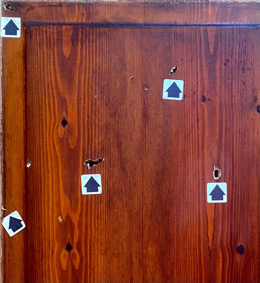 A Door Panel With Bullet Holes & Police Forensic Evidence Markers ...