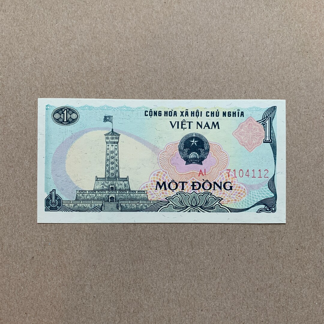 1985 Vietnamese 1 Dong Banknote. Tower of Ha Noi at Left Center. Back ...