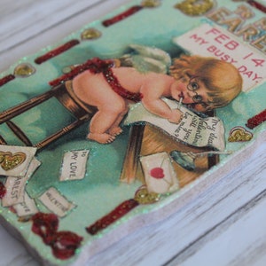 Cupid Writing Love Letters Valentine Ornament Vintage Card Image ...