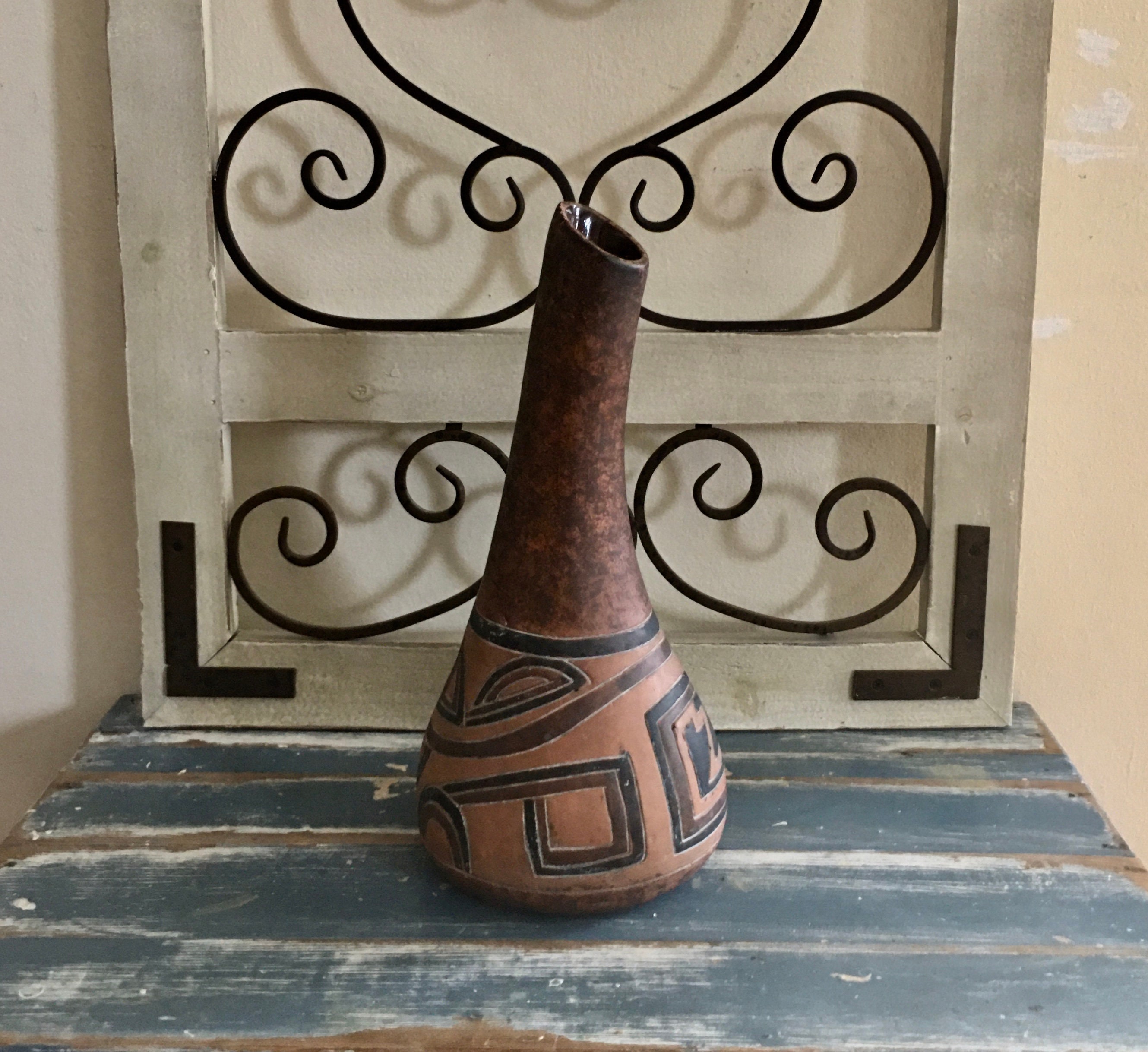 Clay Pitcher Pouring Water