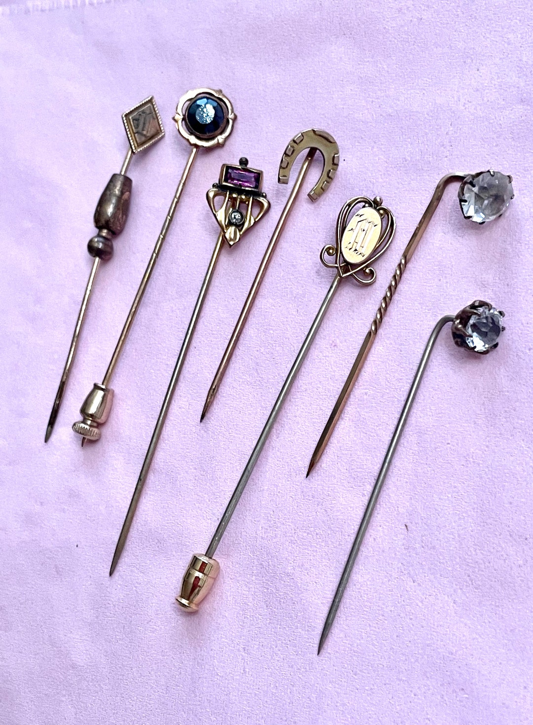 A Collection of 7 Pieces of Victorian Hat Pins in Goldfilled and Rolled ...