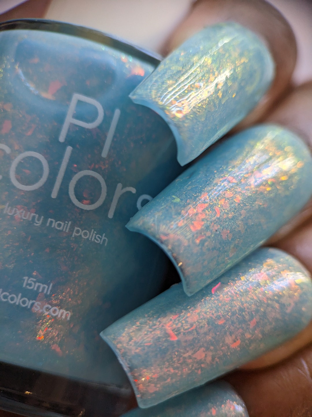 Pale Blue Nail Polish With Iridescent Red Gold Flakies Paradise Blue ...