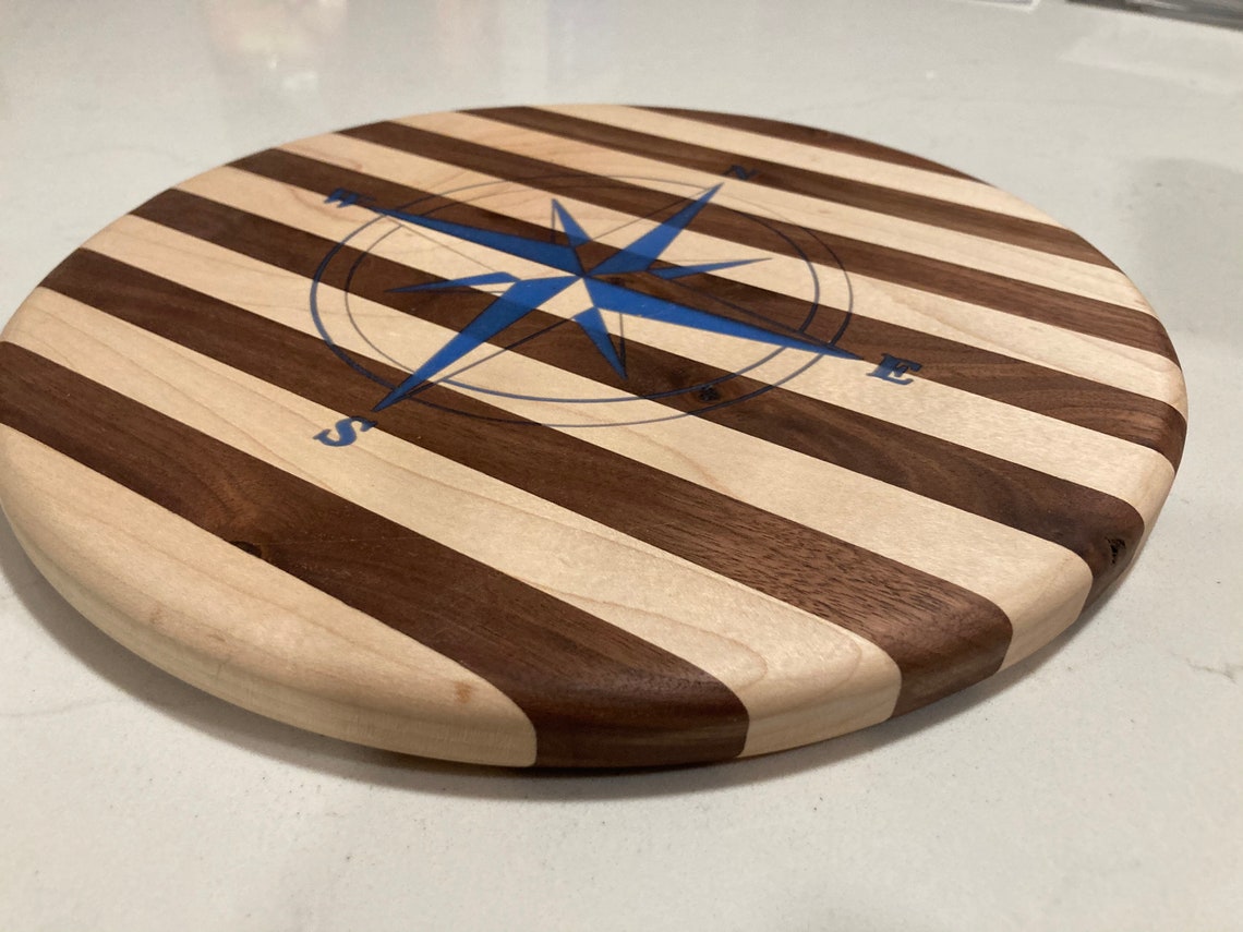Compass rose cnc epoxy filled serving board on black walnut and maple ...