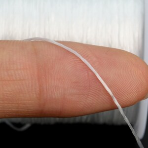 1 Spool - 0.8MM Clear Elastic Cord / Thread 60 Meters Crystal String ...