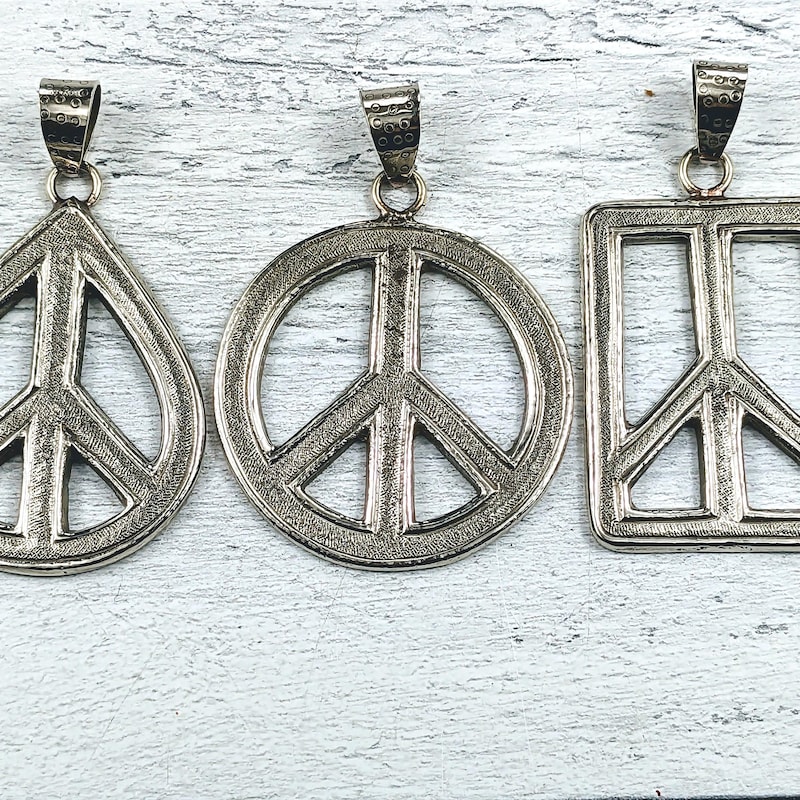 Tibetan Peace Sign Charms - Etsy