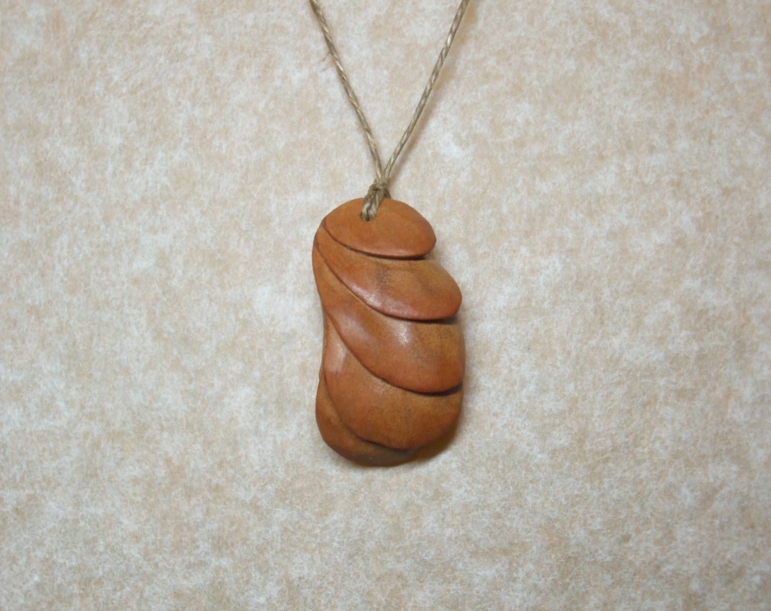 Shell or Faux-fossil Pendant Carved With a Knife From Avocado Pit ...