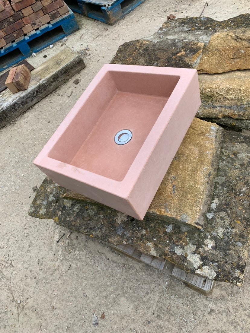 Pastel pink bathroom concrete sink