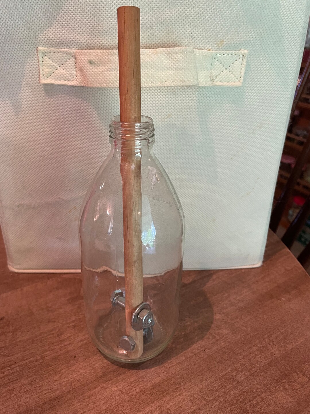 Glass Bottle Puzzle With Wooden Dowel and 2 Sets of Nuts & Bolts Inside ...