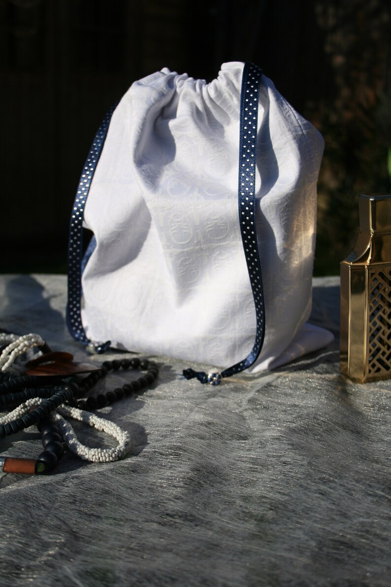 Elegant little white cloth bag with sliding ties and charms | Etsy