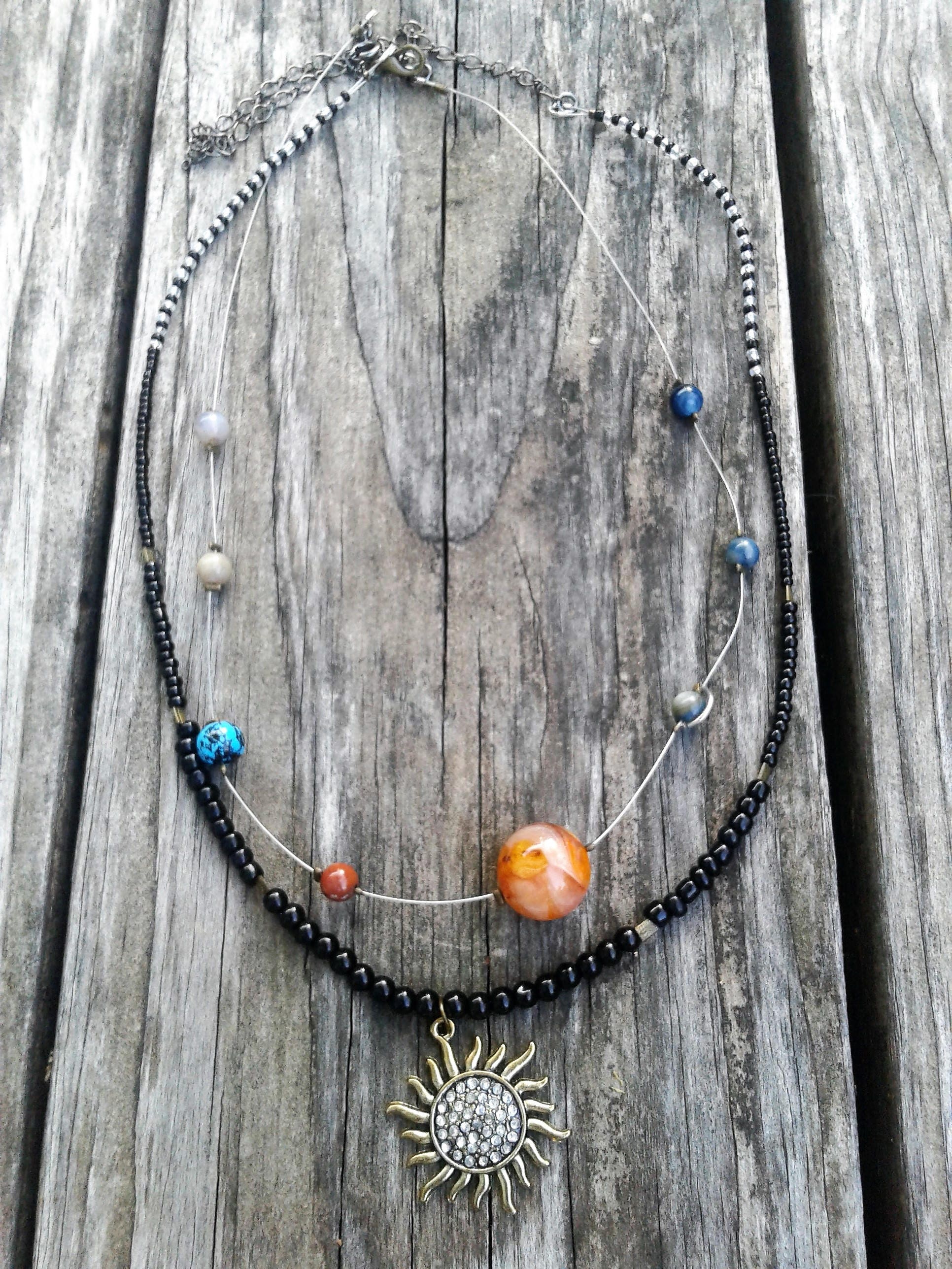 Sistema solar y collares solares - Etsy España