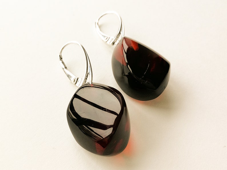 Luxurious dark red amber twisted original shape medium size | Etsy
