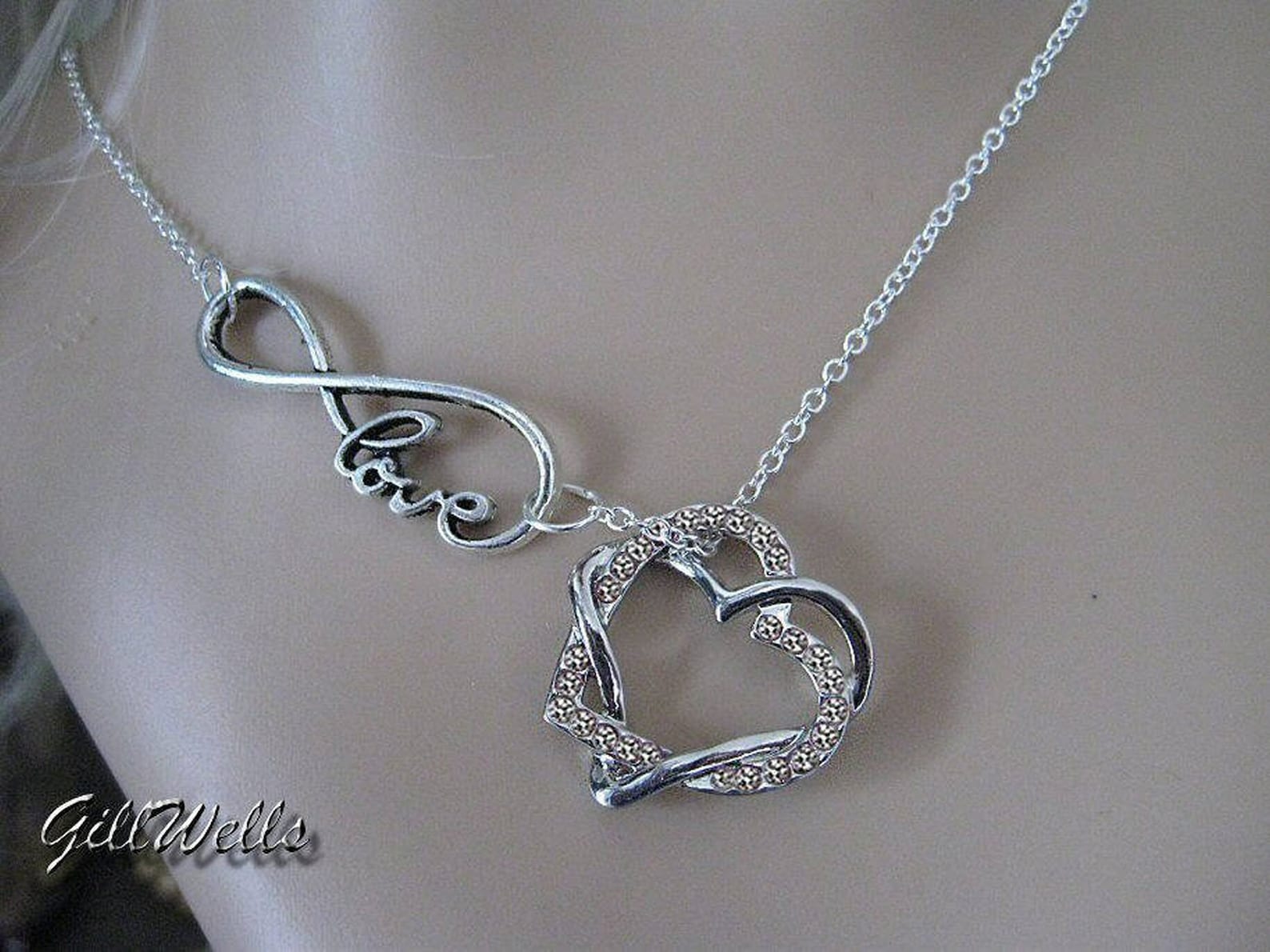 Love infinity necklace with hearts entwined in crystal color | Etsy
