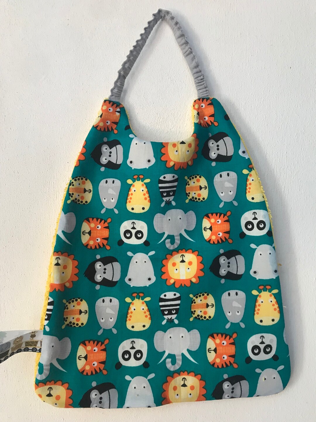 Elasticated Bib in Terry Cloth and Cotton With "jungle Animal" Motifs ...