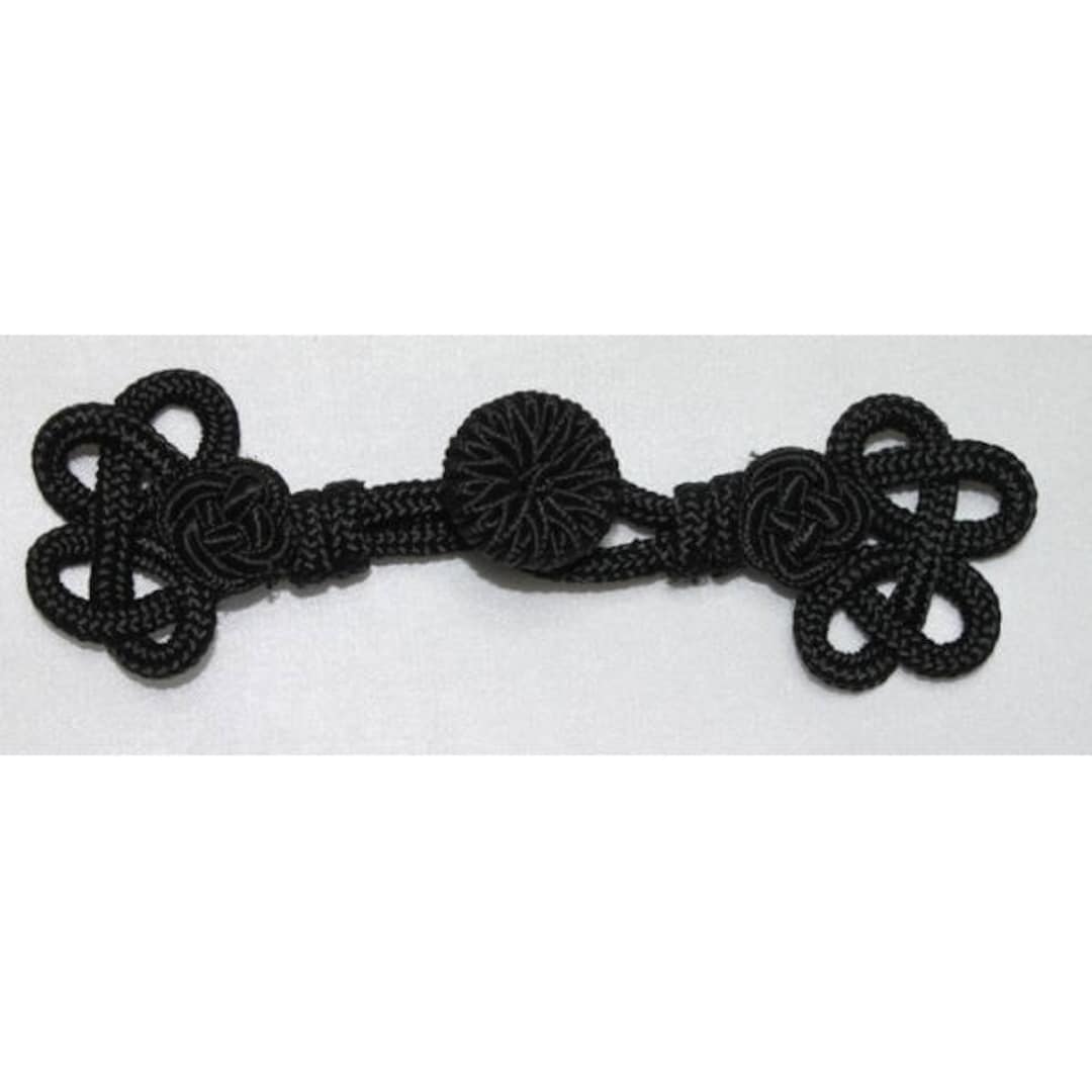 Black Toggle Button, a Fastener That Will Adorn All Coats, Jackets, Etc ...