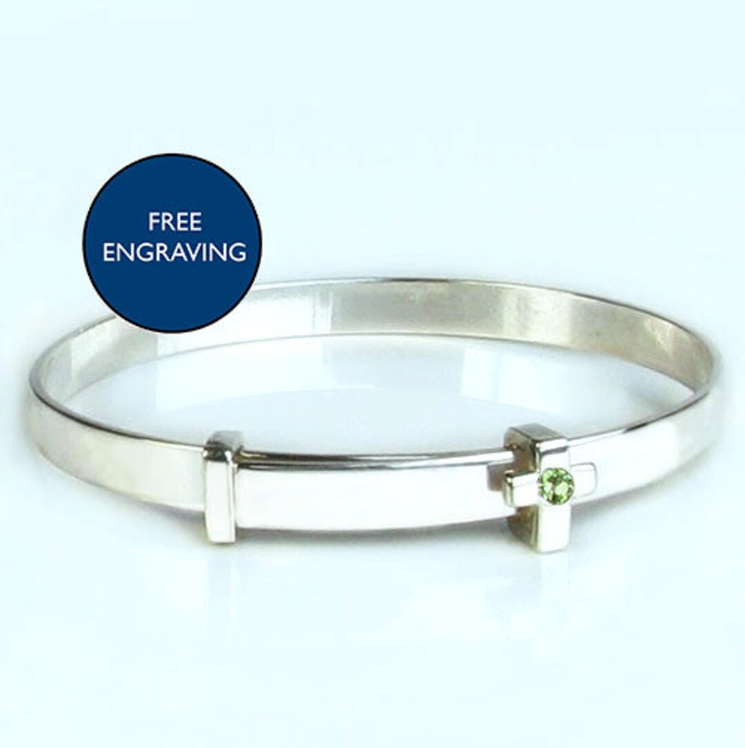 A Silver August Birthstone Cross Bangle-childs August Birthstone Bangle ...