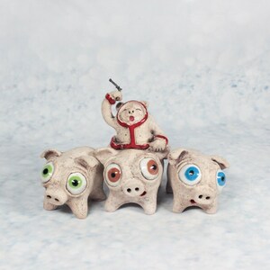 Gnoo-mee Kid Riding on a Pig. Fun Ceramic Figurine of a Playing Gnome ...