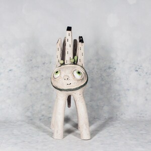 A Funny Monster Carries a City With Skyscrapers. Decoration for Home ...