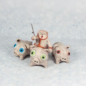 Gnoo-mee Kid Riding on a Pig. Fun Ceramic Figurine of a Playing Gnome ...