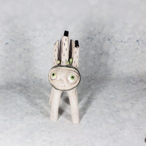 A Funny Monster Carries a City With Skyscrapers. Decoration for Home ...