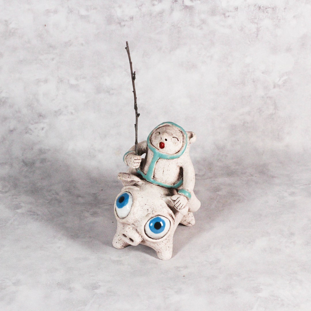 Gnoo-mee Kid Riding on a Pig. Fun Ceramic Figurine of a Playing Gnome ...