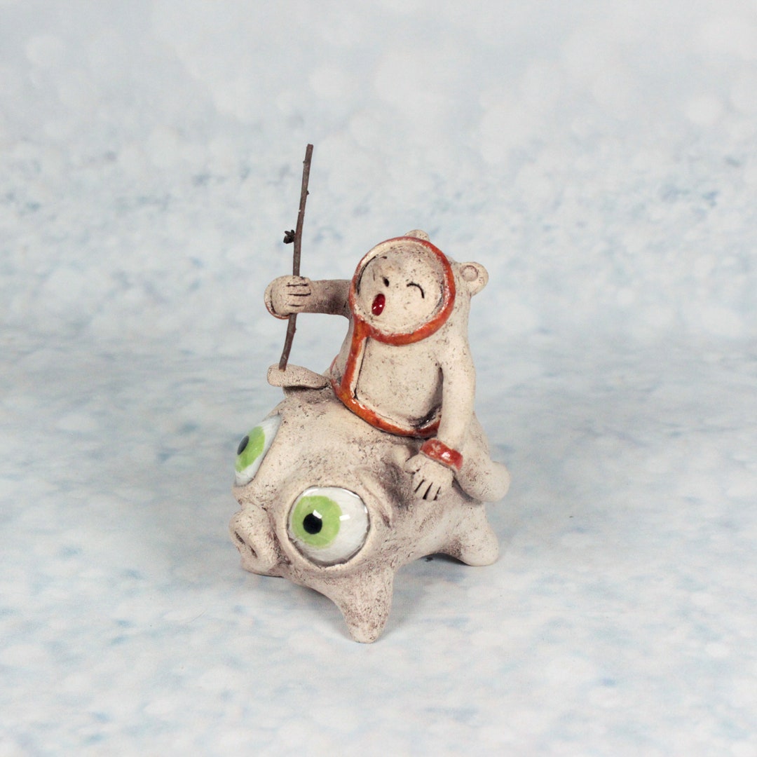 Gnoo-mee Kid Riding on a Pig. Fun Ceramic Figurine of a Playing Gnome ...