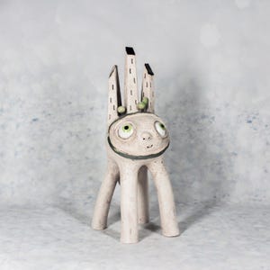 A Funny Monster Carries a City With Skyscrapers. Decoration for Home ...