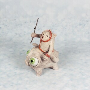 Gnoo-mee Kid Riding on a Pig. Fun Ceramic Figurine of a Playing Gnome ...