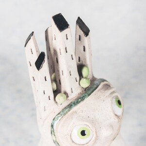 A Funny Monster Carries a City With Skyscrapers. Decoration for Home ...