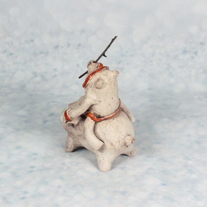 Gnoo-mee Kid Riding on a Pig. Fun Ceramic Figurine of a Playing Gnome ...