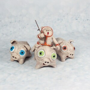 Gnoo-mee Kid Riding on a Pig. Fun Ceramic Figurine of a Playing Gnome ...