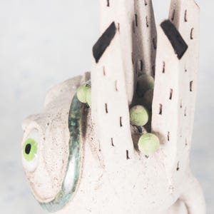 A Funny Monster Carries a City With Skyscrapers. Decoration for Home ...