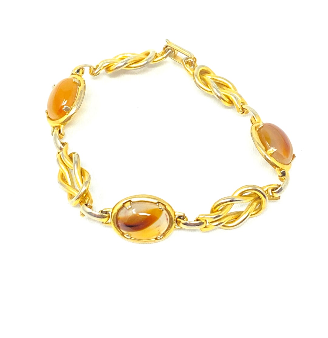 Vintage 1940s marrone muschio agata e oro tono metallo ovale e nodo ...