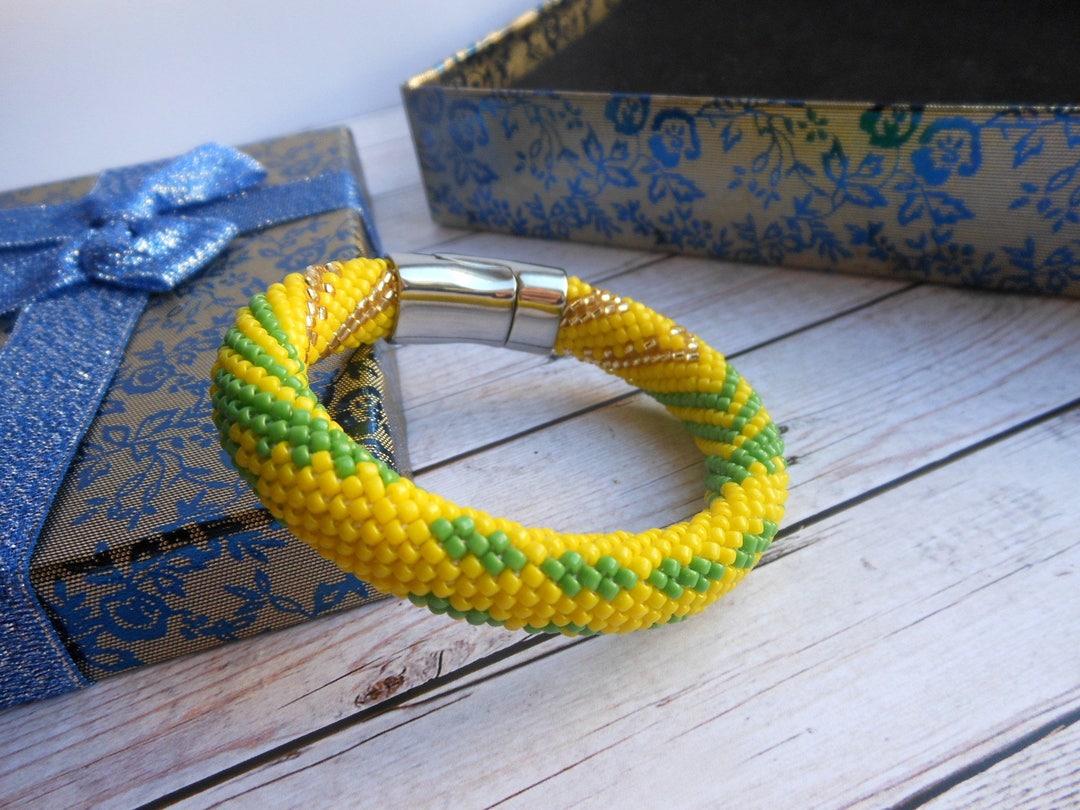 Idde De Orula Con Detalles De Oshun Edibere Orula Oshun Beads Oshun ...