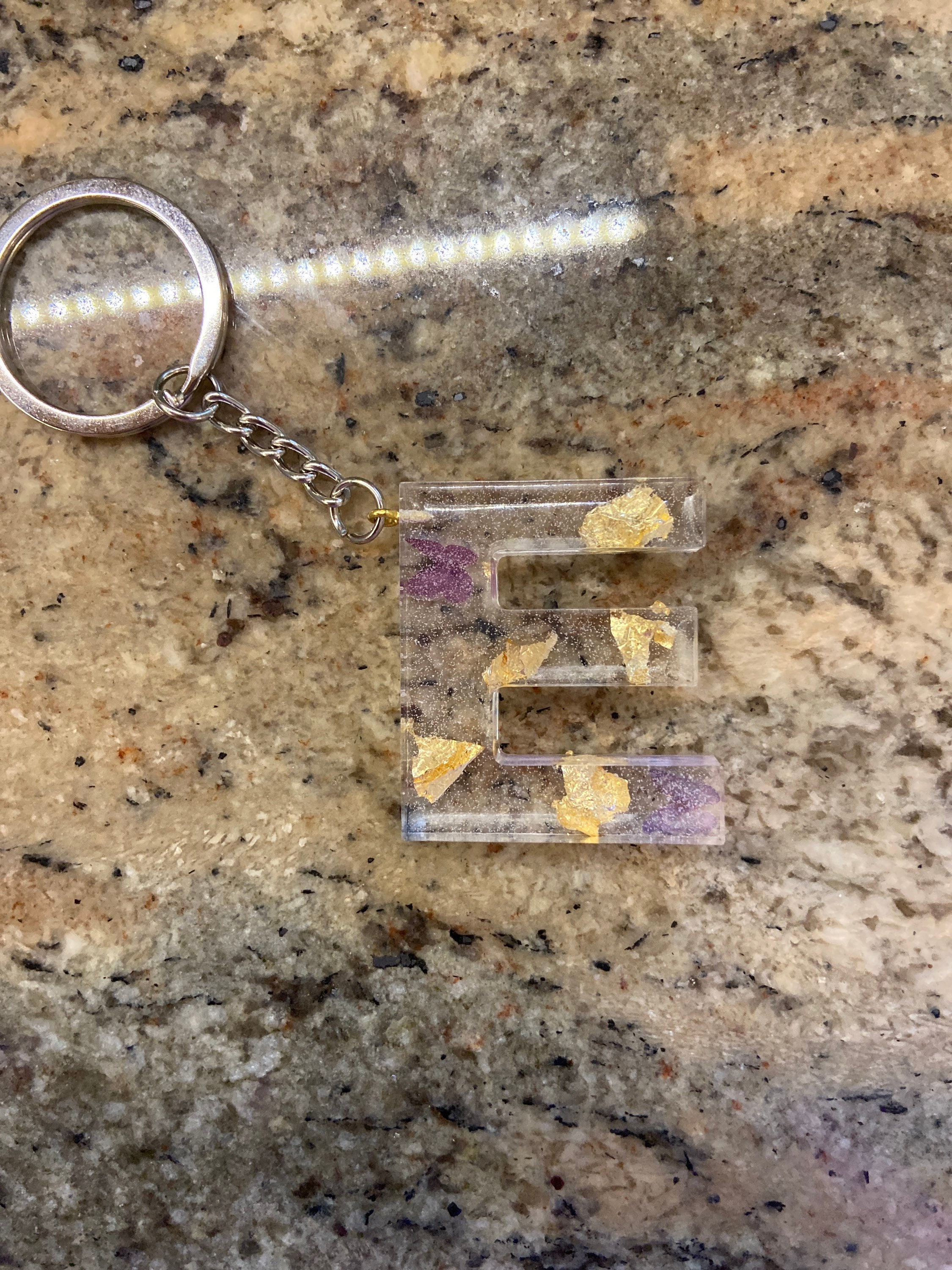 Letter E resin keychain with gold and purple butterfly accents | Etsy