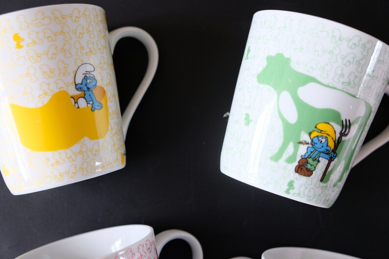 The Smurfs - 6 Coffee / Tea Cups (please Note One Cup Damaged ...