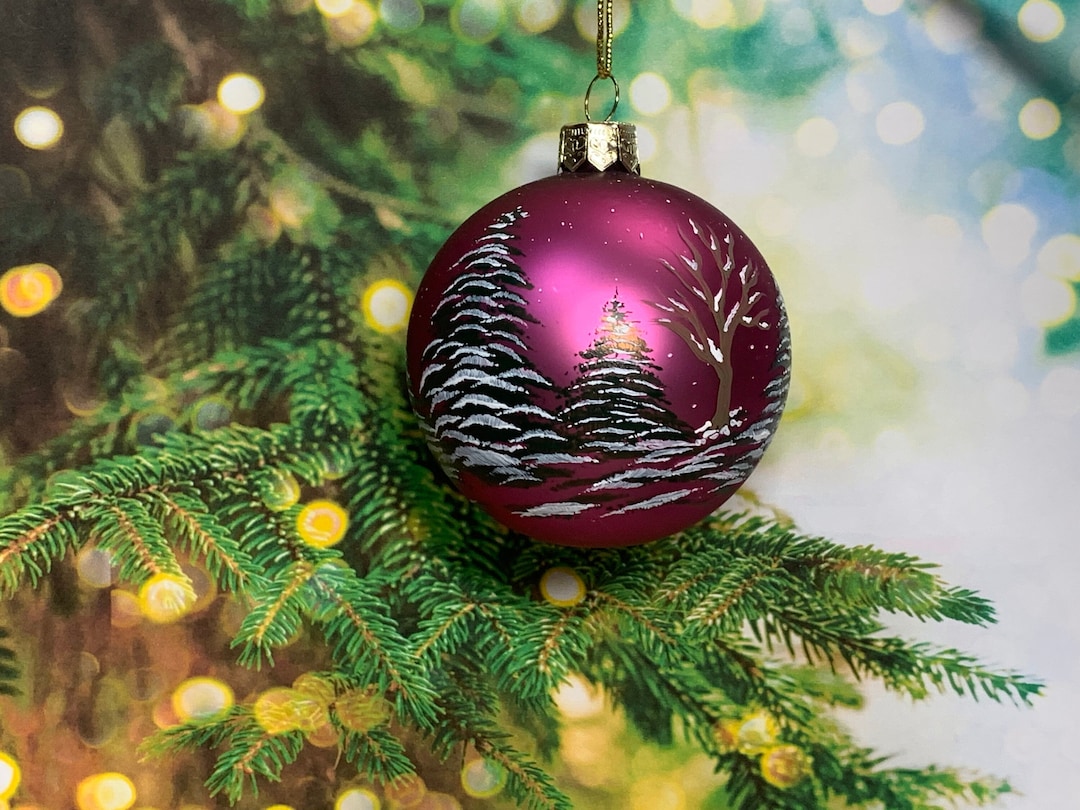 Dark Pink Glass Ornaments With Snow Covered Trees Painted All Around ...