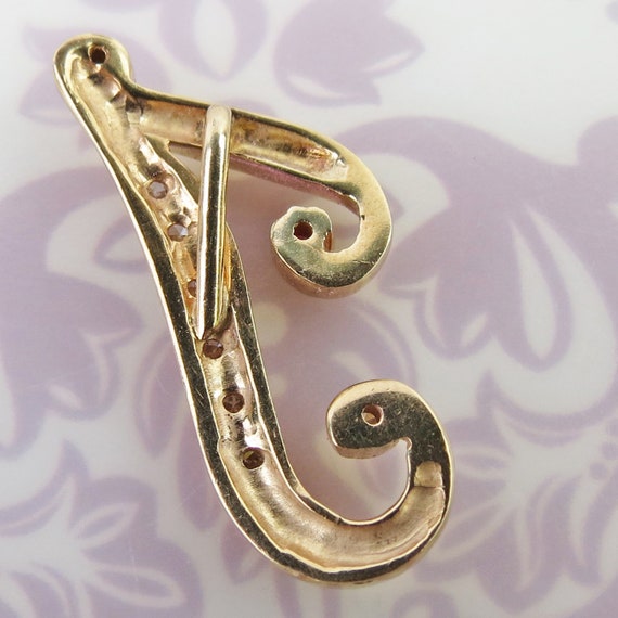 Stylish flowing letter " T " 14k gold diamond journey… - Gem