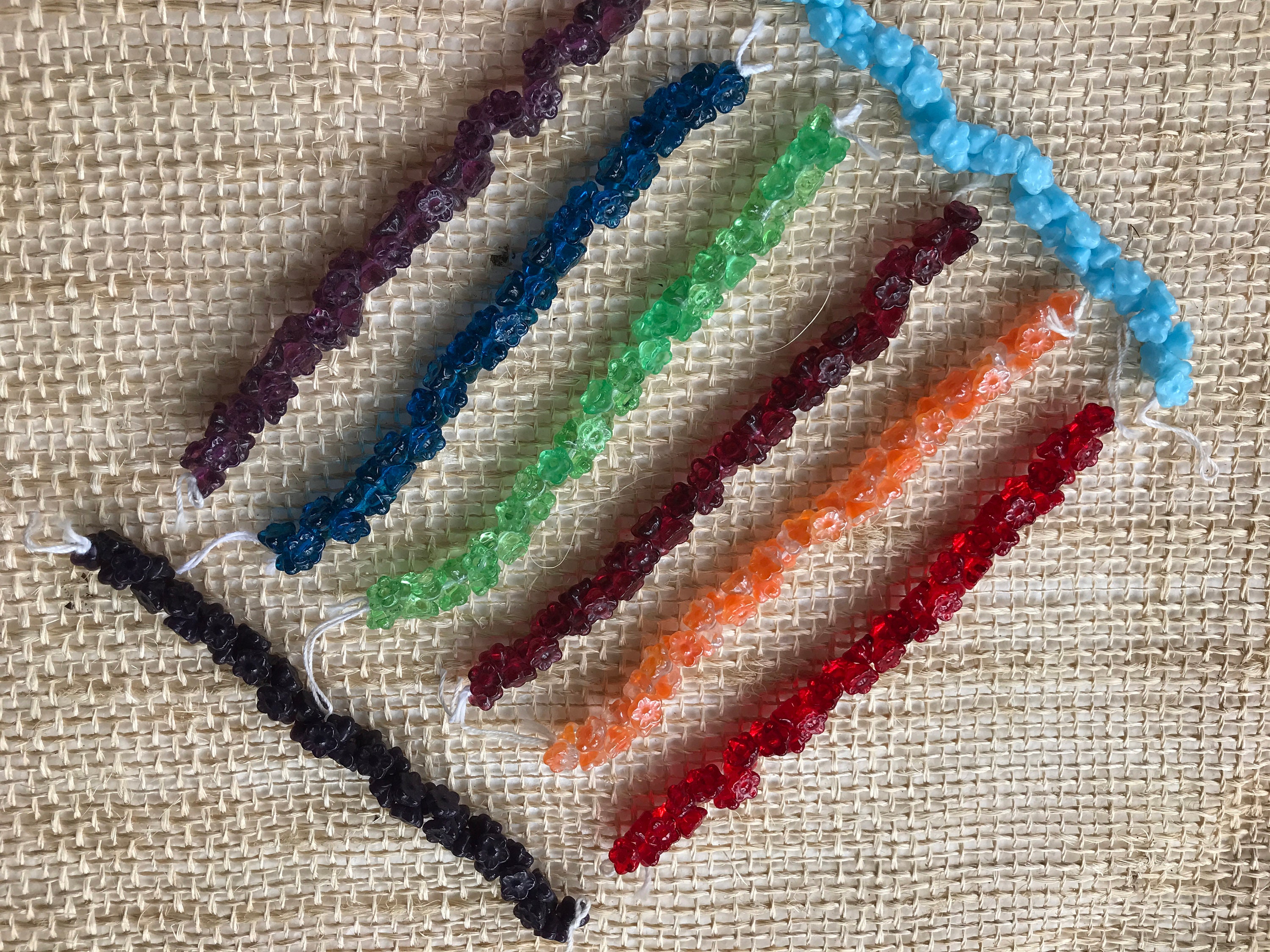 Bundle of 8 Tiny Flower Bead Strands in 8 Colors - Etsy Sweden