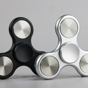 The Classic Fidget Spinner Tri Shape Silver or Black Hand - Etsy