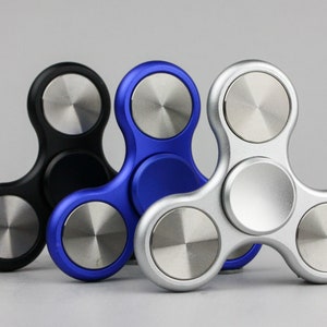 The Classic Fidget Spinner Tri Shape Metal Spinner, in Black, Silver ...