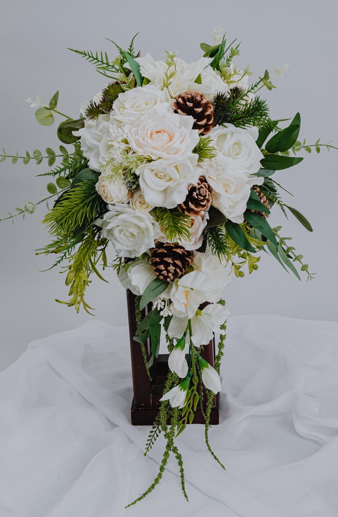 Winter Cascading Bridal Bouquet With Pinecones White Roses and Greenery ...
