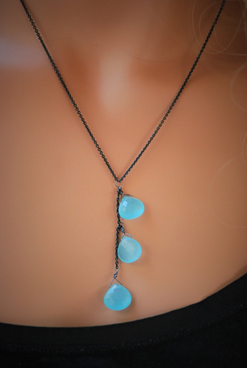 Aqua chalcedony cascade along black chain. | Etsy