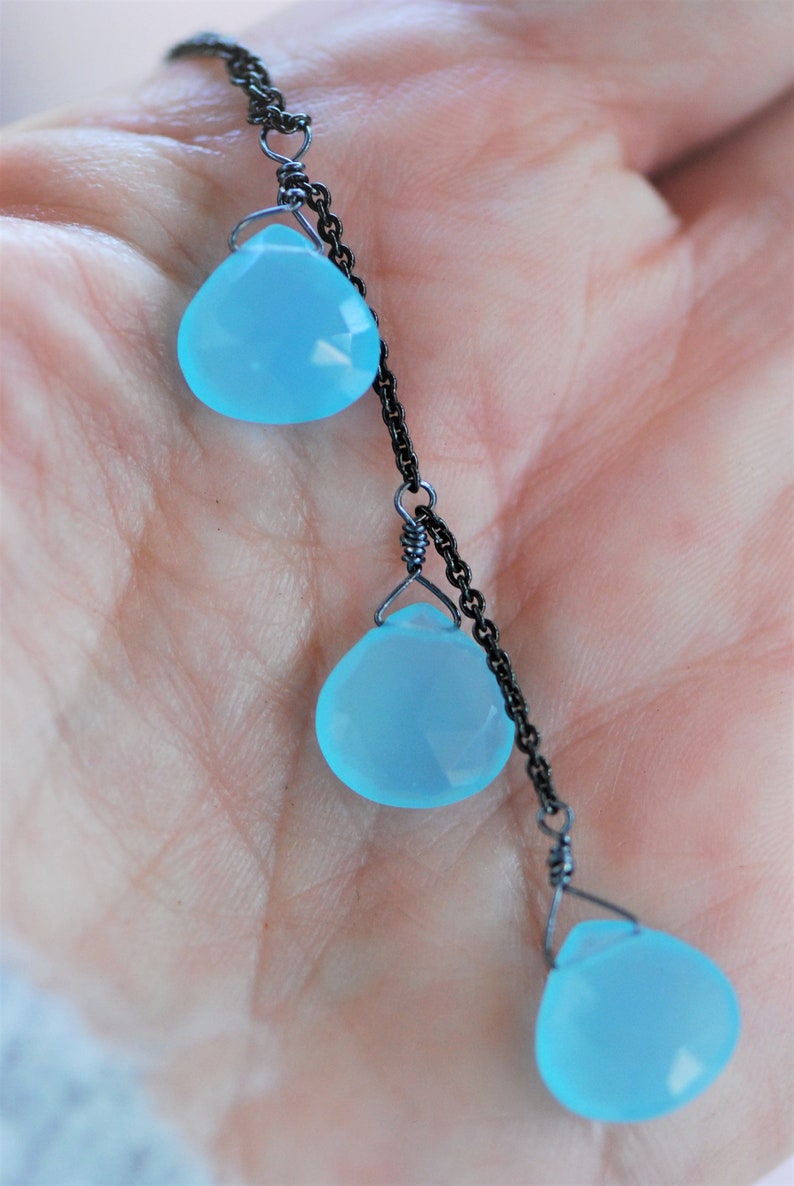 Aqua chalcedony cascade along black chain. | Etsy