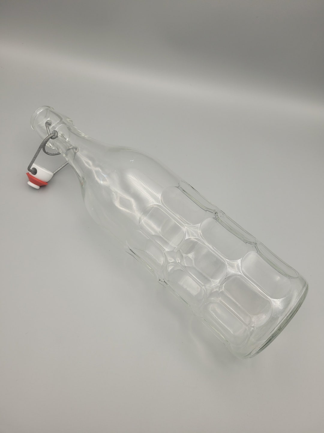 Vintage Clasp Top Clear Glass Bottle With Paneled Thumb Print Design ...