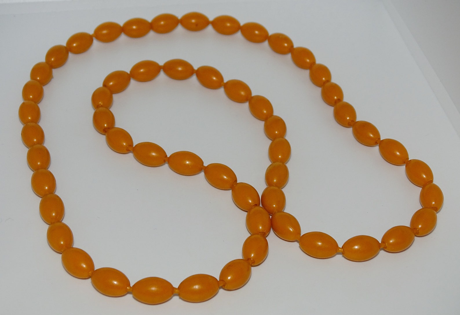 Vintage Retro Popper Poppet Orange Coloured Oval Shaped Plastic Beads ...