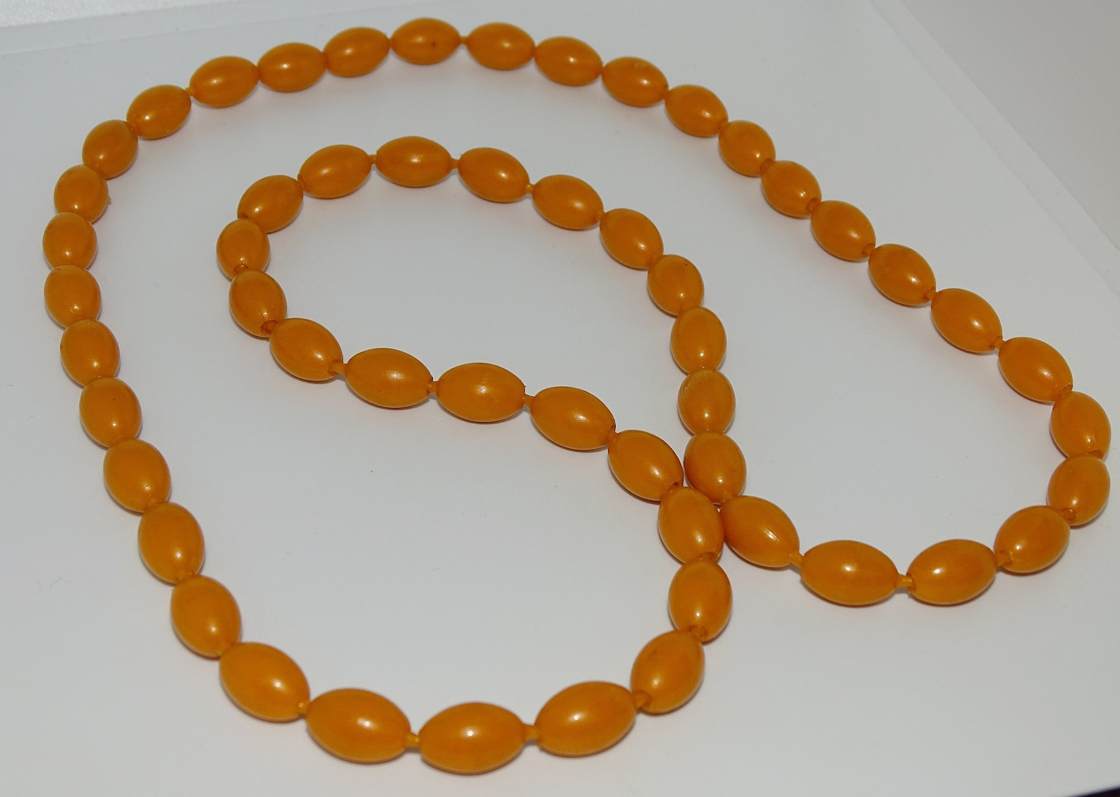 Vintage Retro Popper Poppet Orange Coloured Oval Shaped Plastic Beads ...