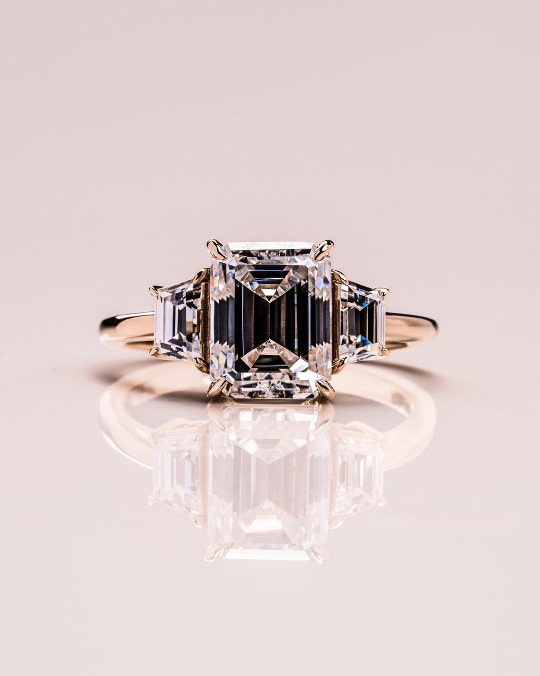 Rhonda Emerald Cut Center Stone & Step Cut Trapezoid Side Stones ...