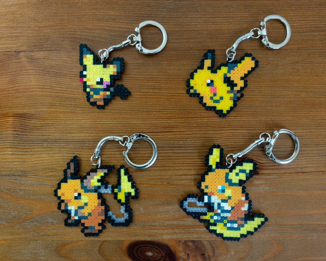 Pichu, Pikachu, Raichu and Alolan Raichu Pokemon Keychains, Pins ...