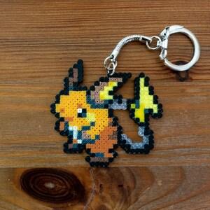 Pichu, Pikachu, Raichu and Alolan Raichu Pokemon Keychains, Pins ...