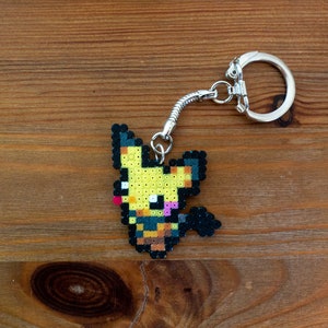 Pichu, Pikachu, Raichu and Alolan Raichu Pokemon Keychains, Pins ...